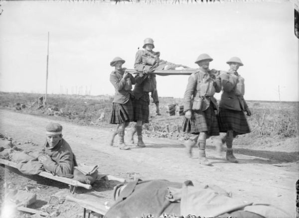 South Africans carrying a wounded enemy German soldier to a medical ...